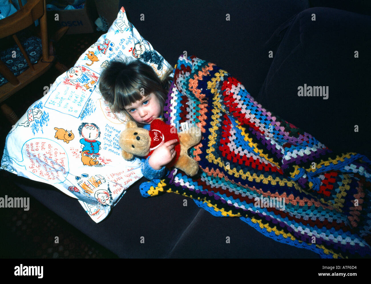 3 Year Old Child Awake on Sofa Holding Teddy Bear Stock Photo - Alamy