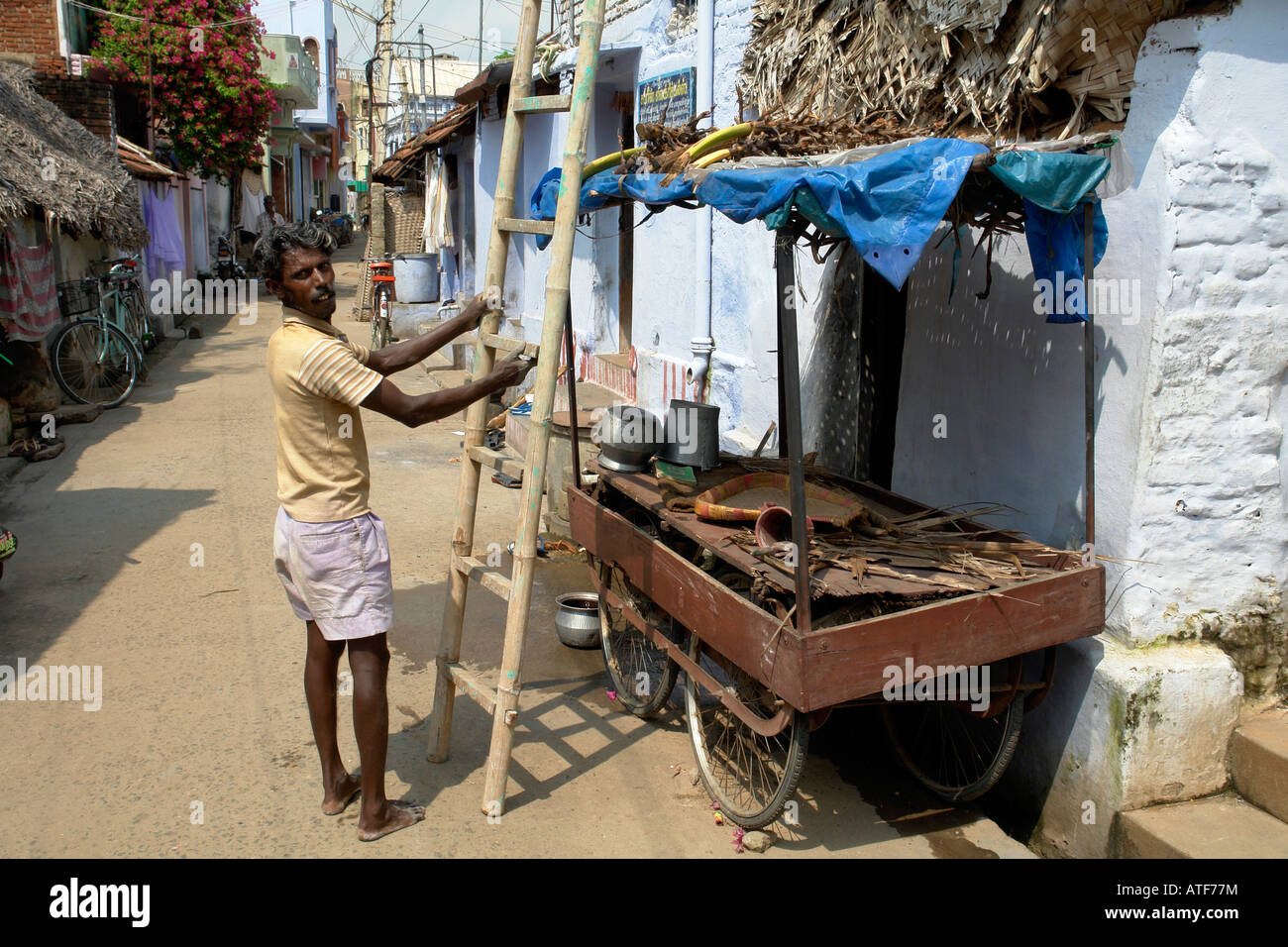indian workman in village backstreet near madurai india Stock Photo - Alamy