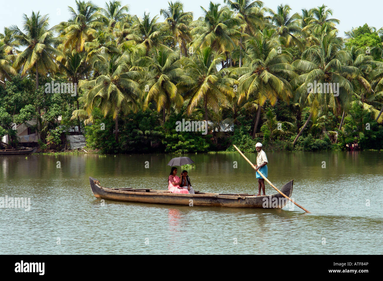 local boatman with ferry crossing of kerala backwaters south india ...