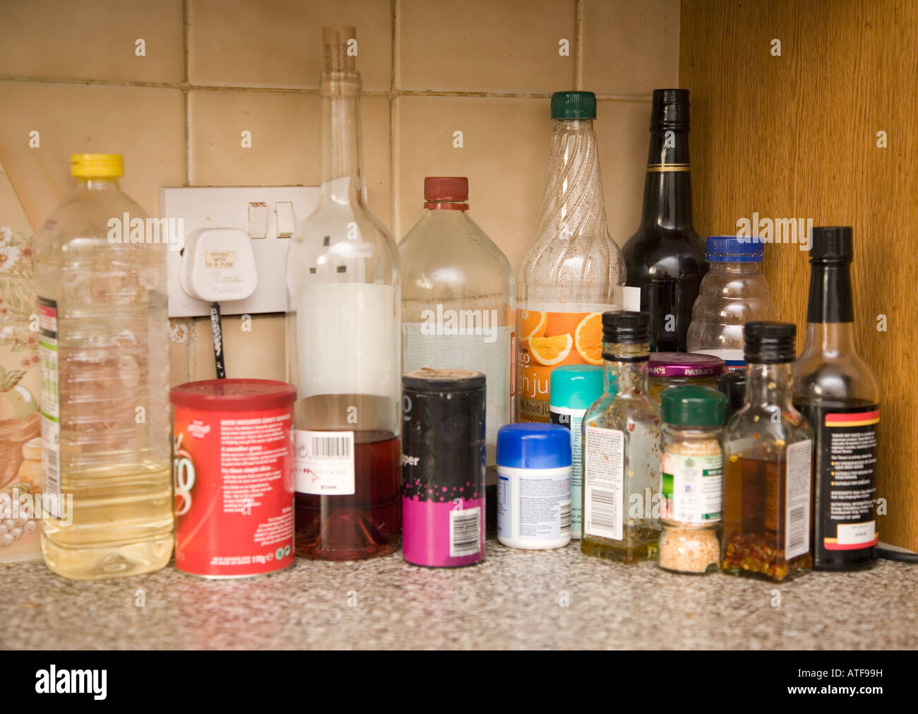 selection of various bottles and jars on a kitchen worktop Stock Photo ...