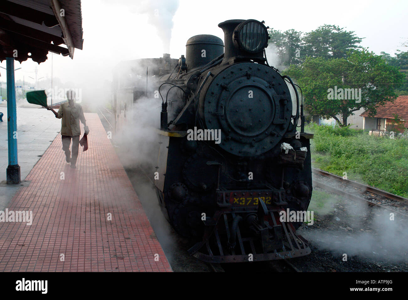 ooty steam train and signalman at mettupalayam station narrow gauge ...