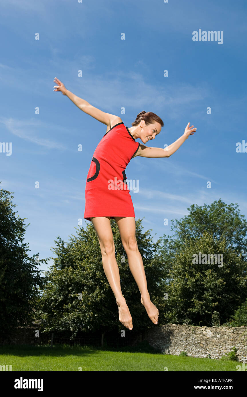 Women dancing jumping white dress hi-res stock photography and images ...