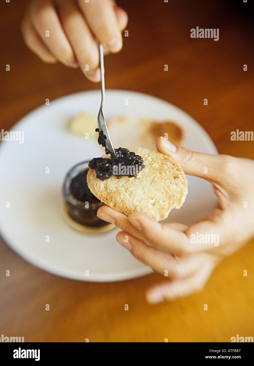 Person with caviar Stock Photo - Alamy