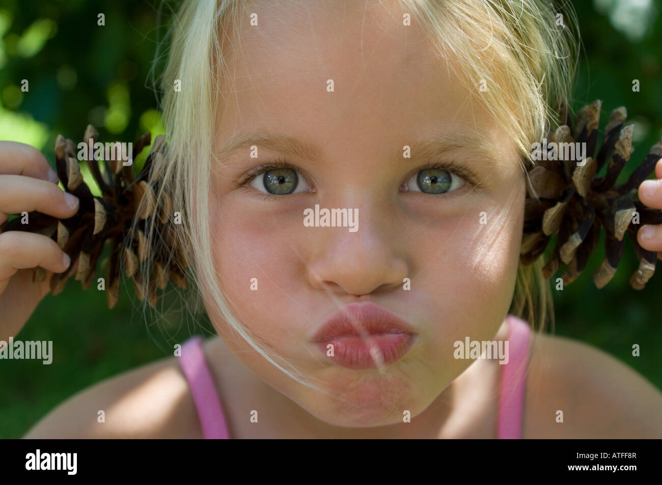 A girl pulling faces Stock Photo - Alamy