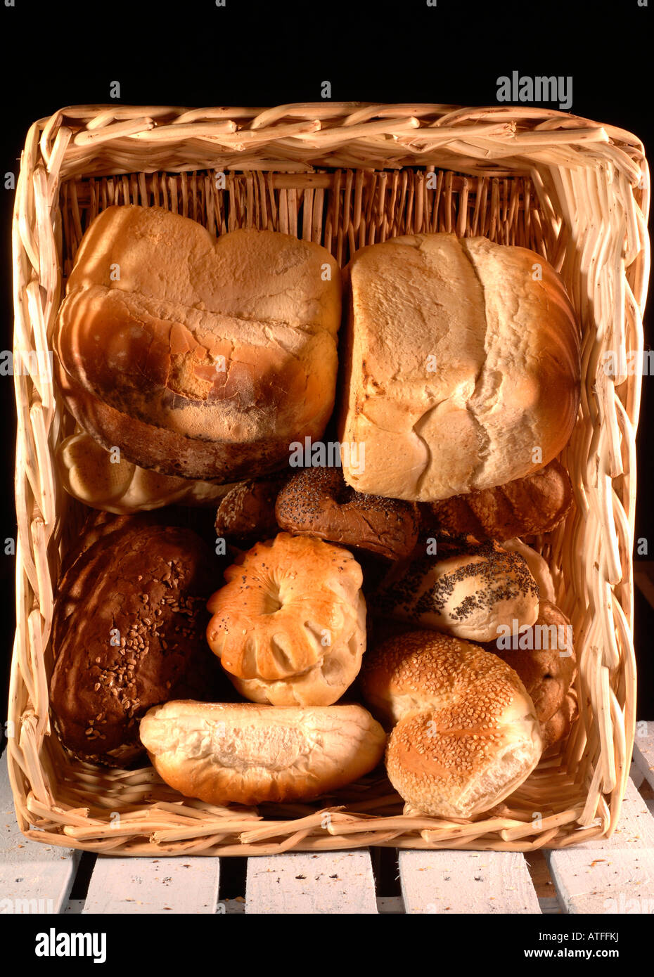 a basket of rustic traditionally baked bread loaves and rolls Stock ...
