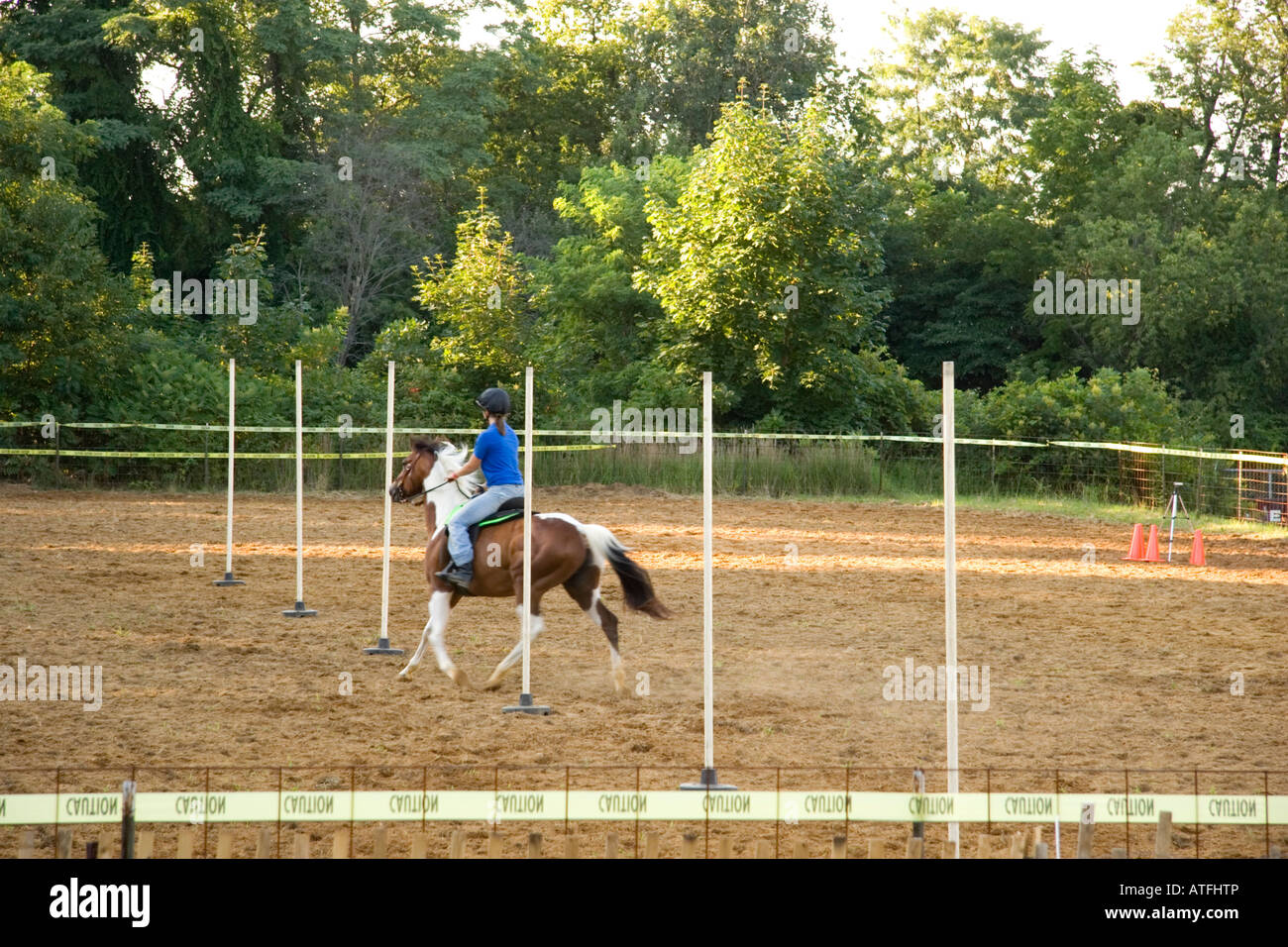 Girl on pony pole bending Stock Photo - Alamy