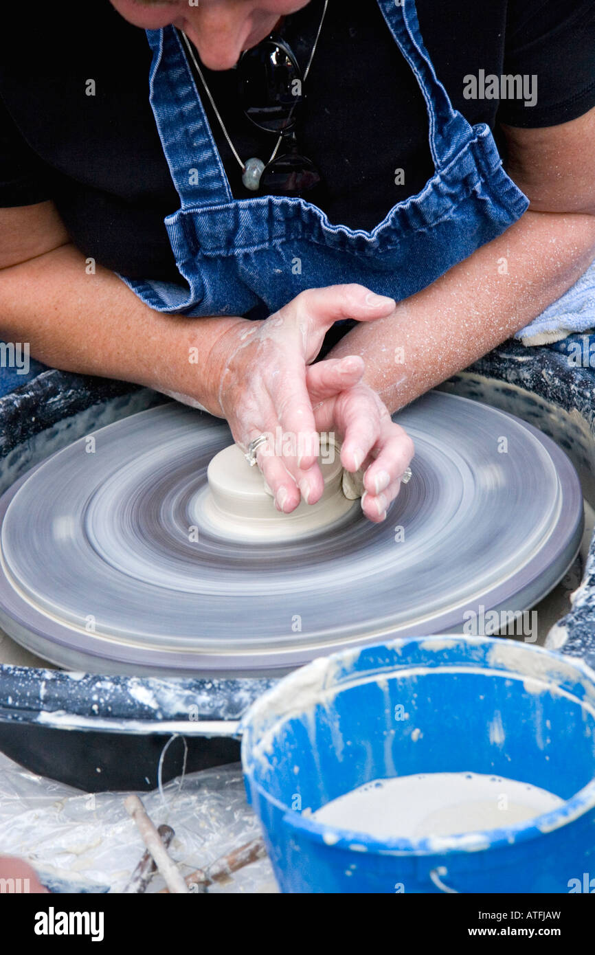Woman working on pottery wheel Stock Photo - Alamy