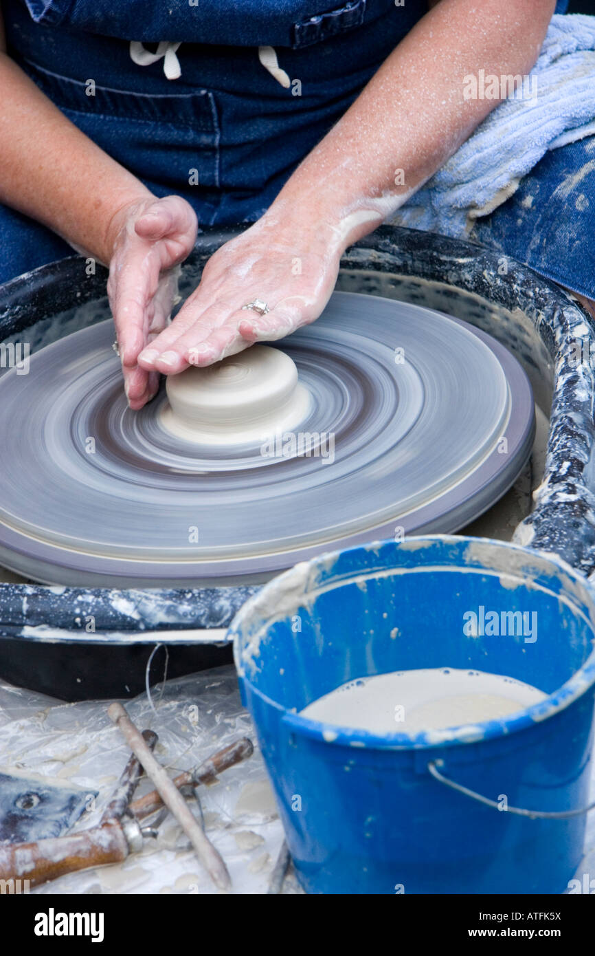 Woman working on pottery wheel Stock Photo - Alamy