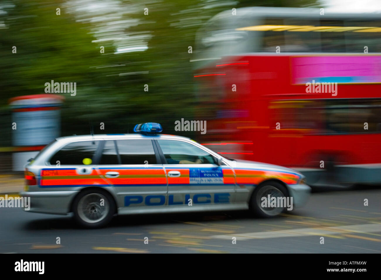 Police car rushing along Bayswater Road in London England UK Stock ...