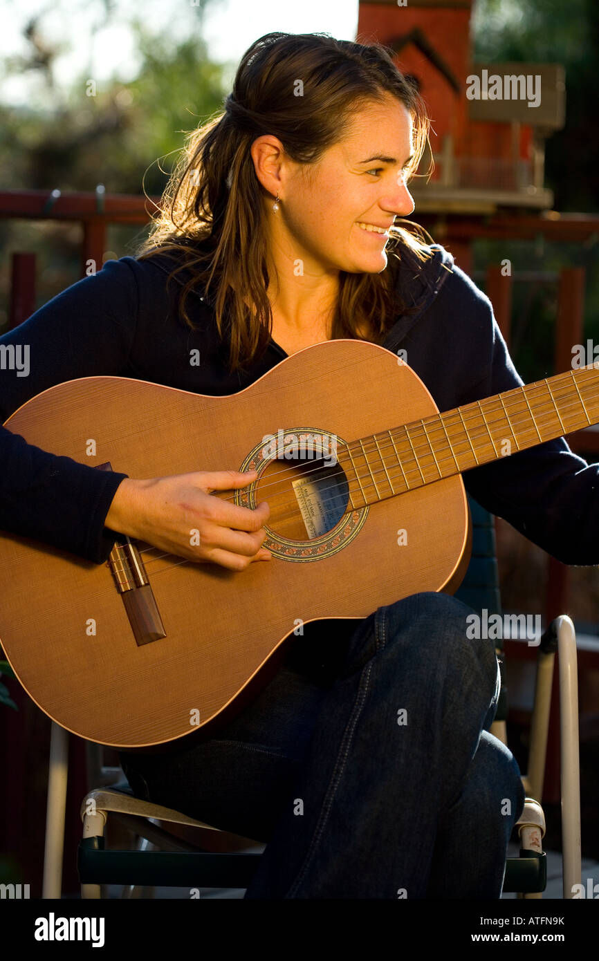 young woman playing the guitar Stock Photo - Alamy
