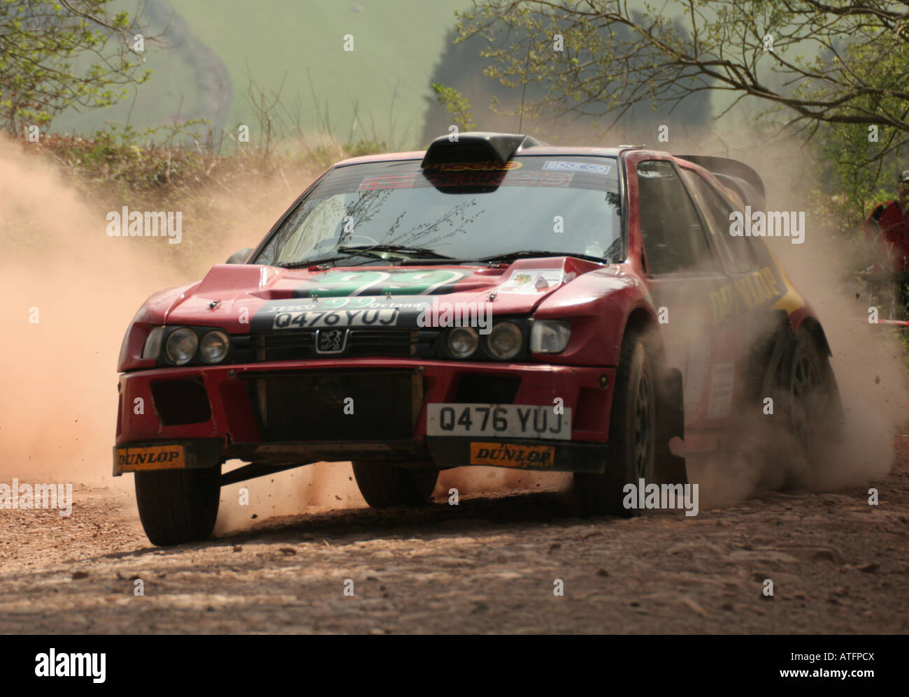 Peugoet rally car blasting through the countryside Stock Photo - Alamy