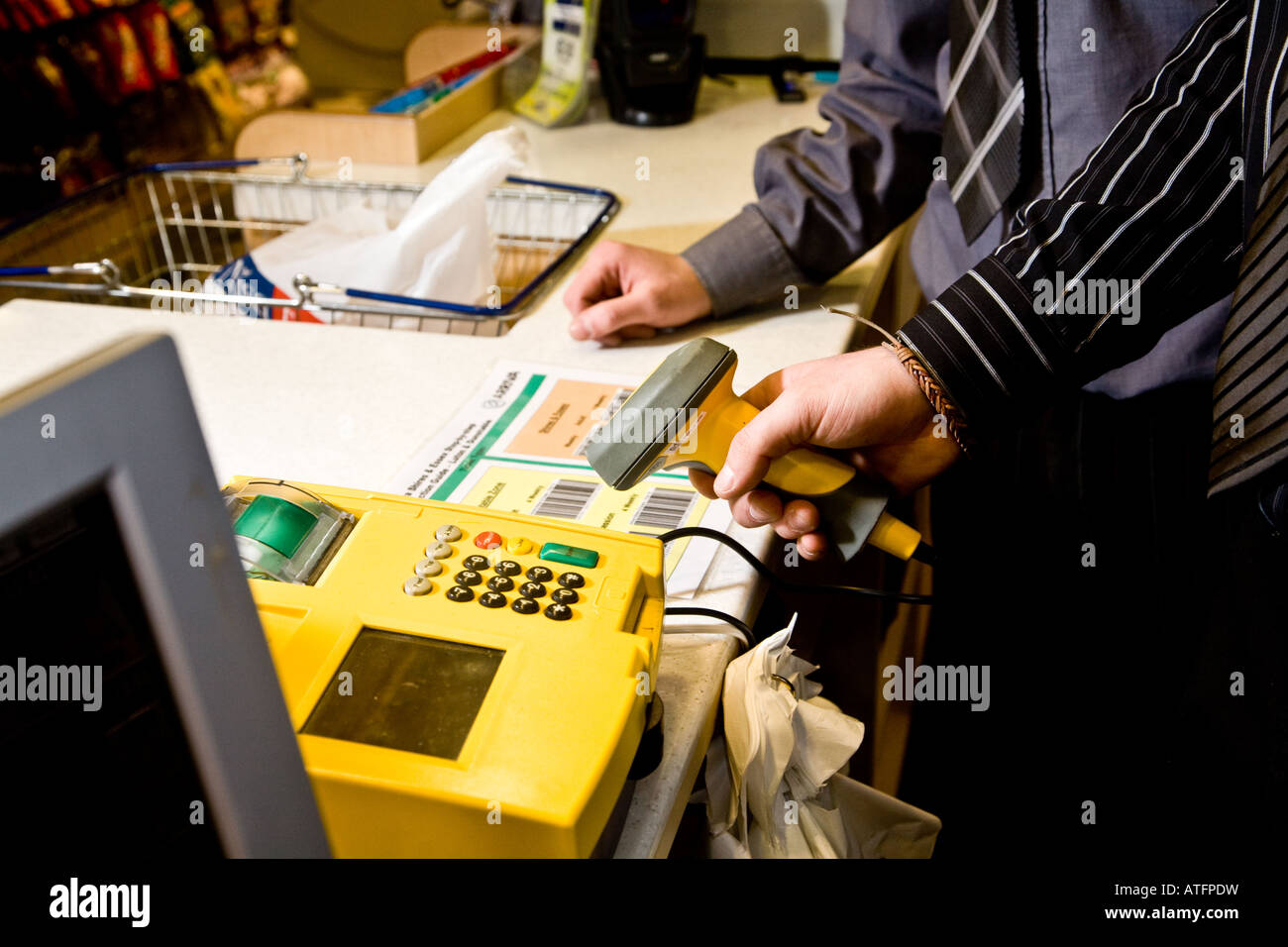 Store staff processing a Paypoint payment at a Convienence store Stock ...