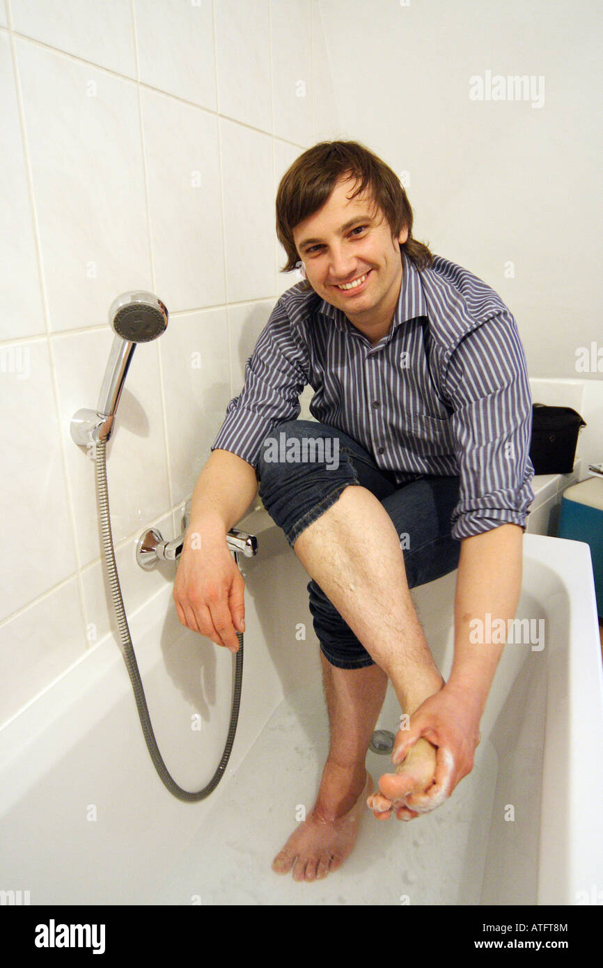 Man washing his feet hi-res stock photography and images - Alamy