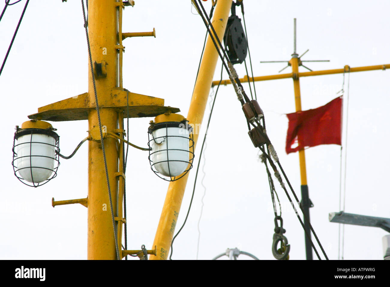 Old soviet ship left to rust in the dock Yellow masts with white lamps ...