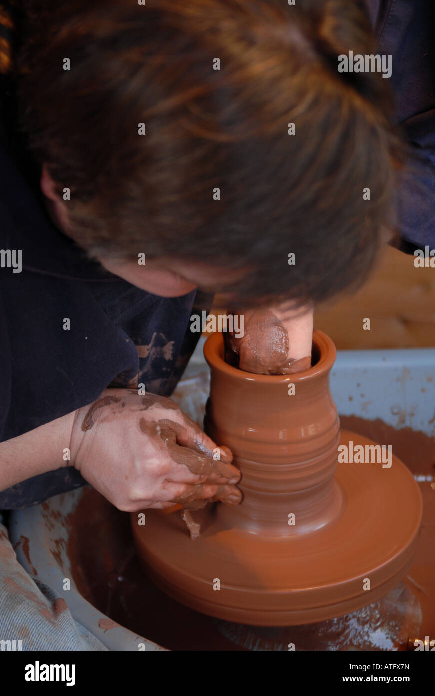 Potter throwing a pot on a wheel Stock Photo - Alamy