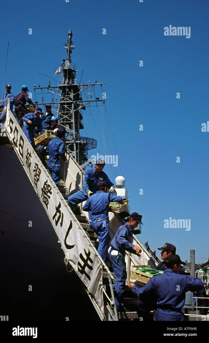 Crew members of Japanese frigate JDS Kashima stock up fresh supplies at ...