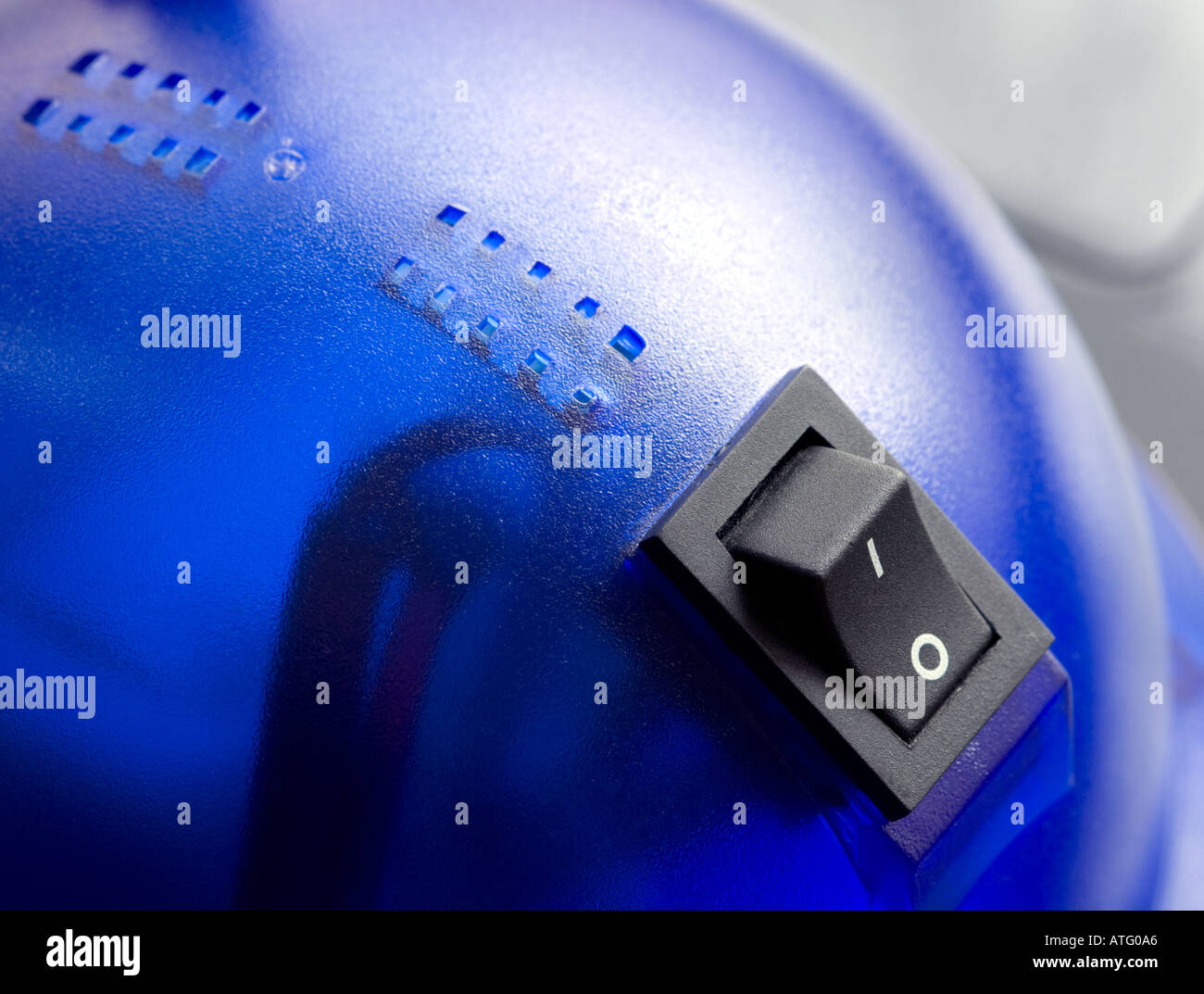 Translucent base of blue desk lamp with on off switch Stock Photo - Alamy