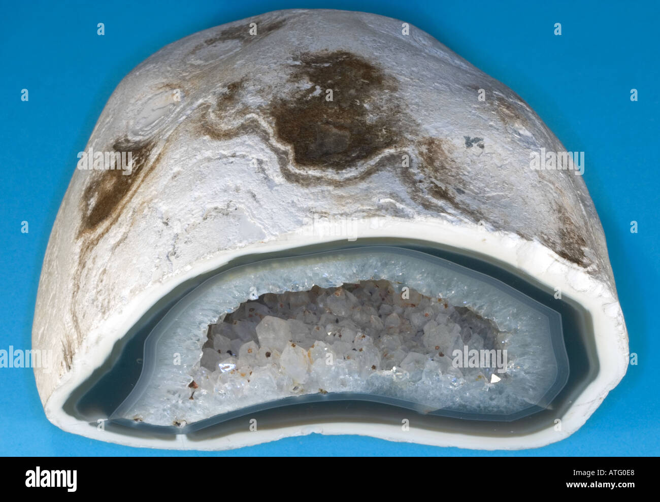 Opened agate bearing rock showing colourful banding and internal ...