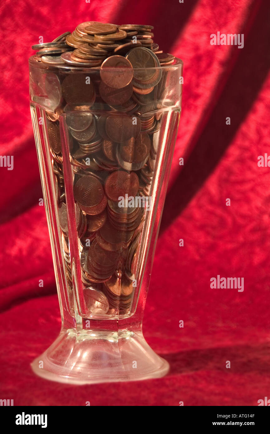 Glass Filled With Coins Stock Photo - Alamy