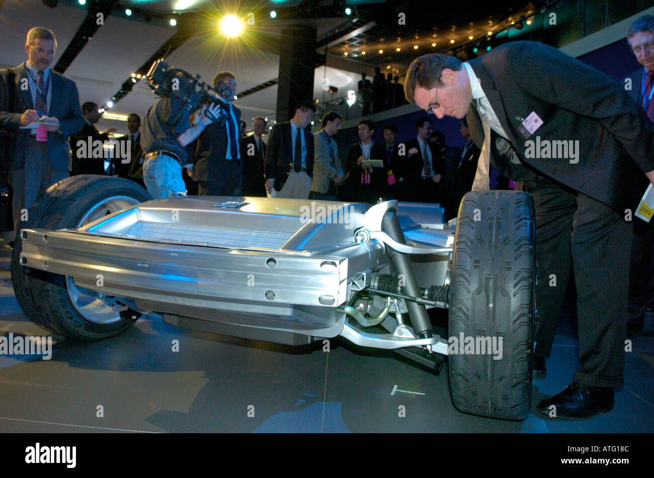 Journalists looking at the chassis of the GM Sequel fuel cell concept ...