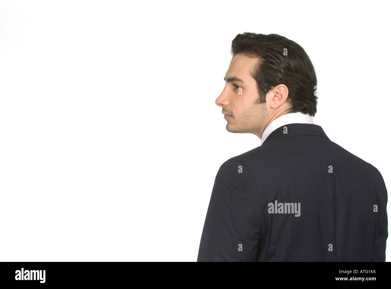 Rear view of a business man looking away Stock Photo - Alamy