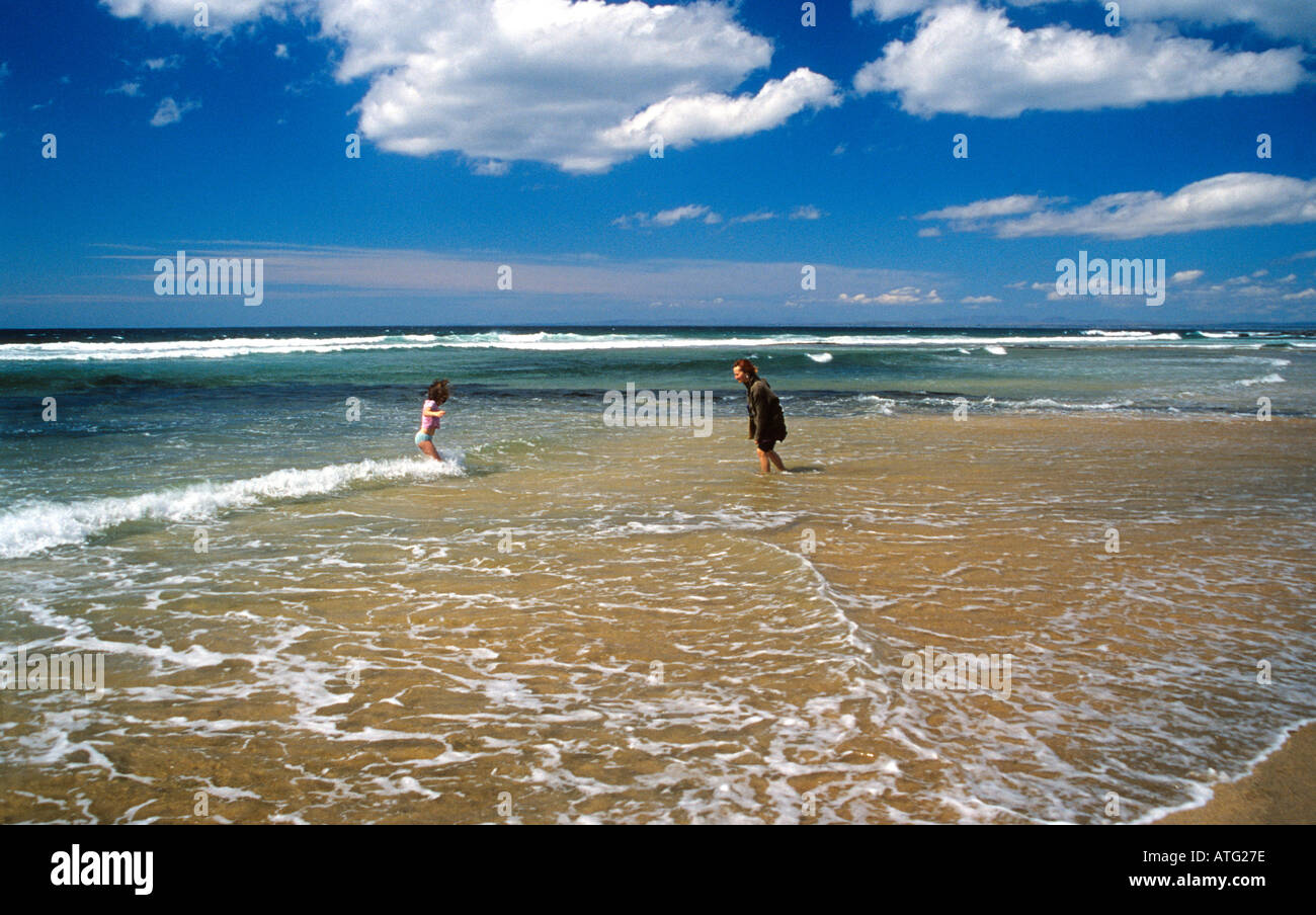 Woman and child playing in surf Fanore Beach Ballyvaughan Co Clare ...