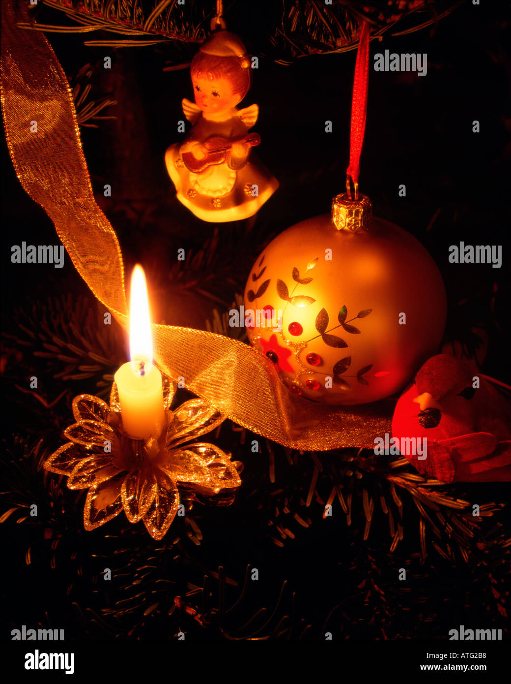 Real candle on Decorated Christmas Tree Stock Photo - Alamy