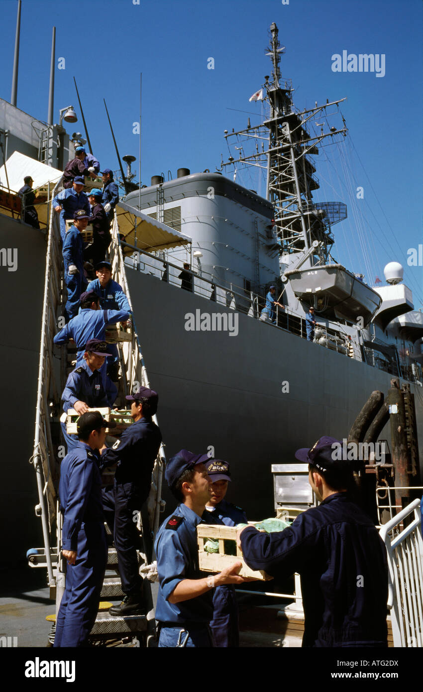 Crew members of Japanese frigate JDS Kashima stock up fresh supplies at ...