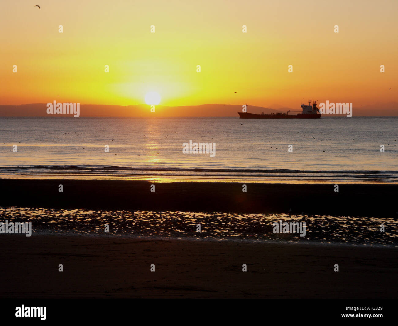 Sunset with ship over the Mersey Estuary 2 Stock Photo - Alamy