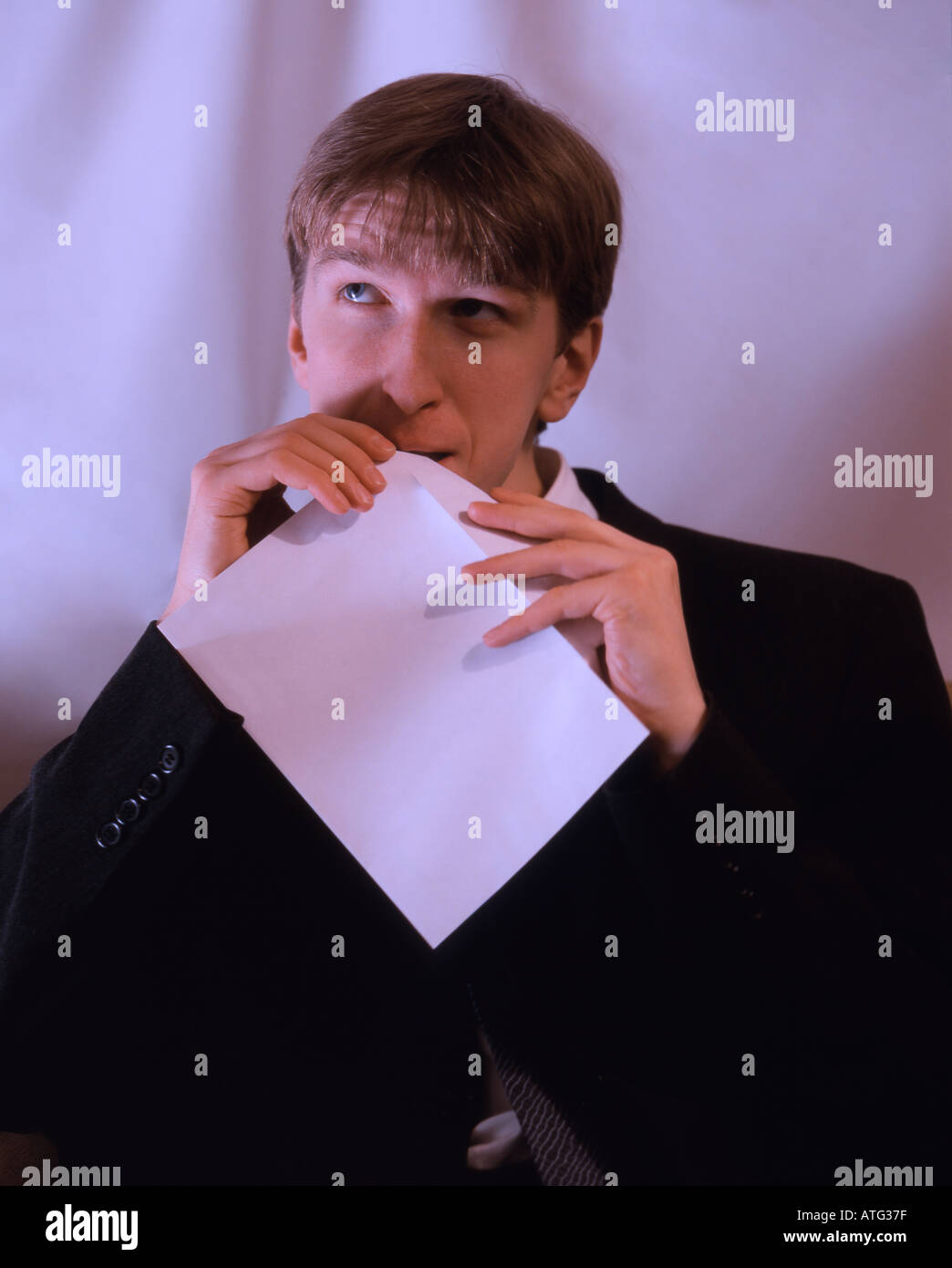 Man in suit sealing an envelope Stock Photo - Alamy