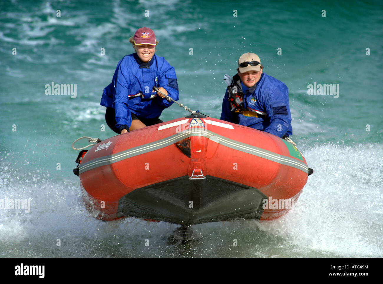 Two women lifesavers return to shore during the National Surf ...