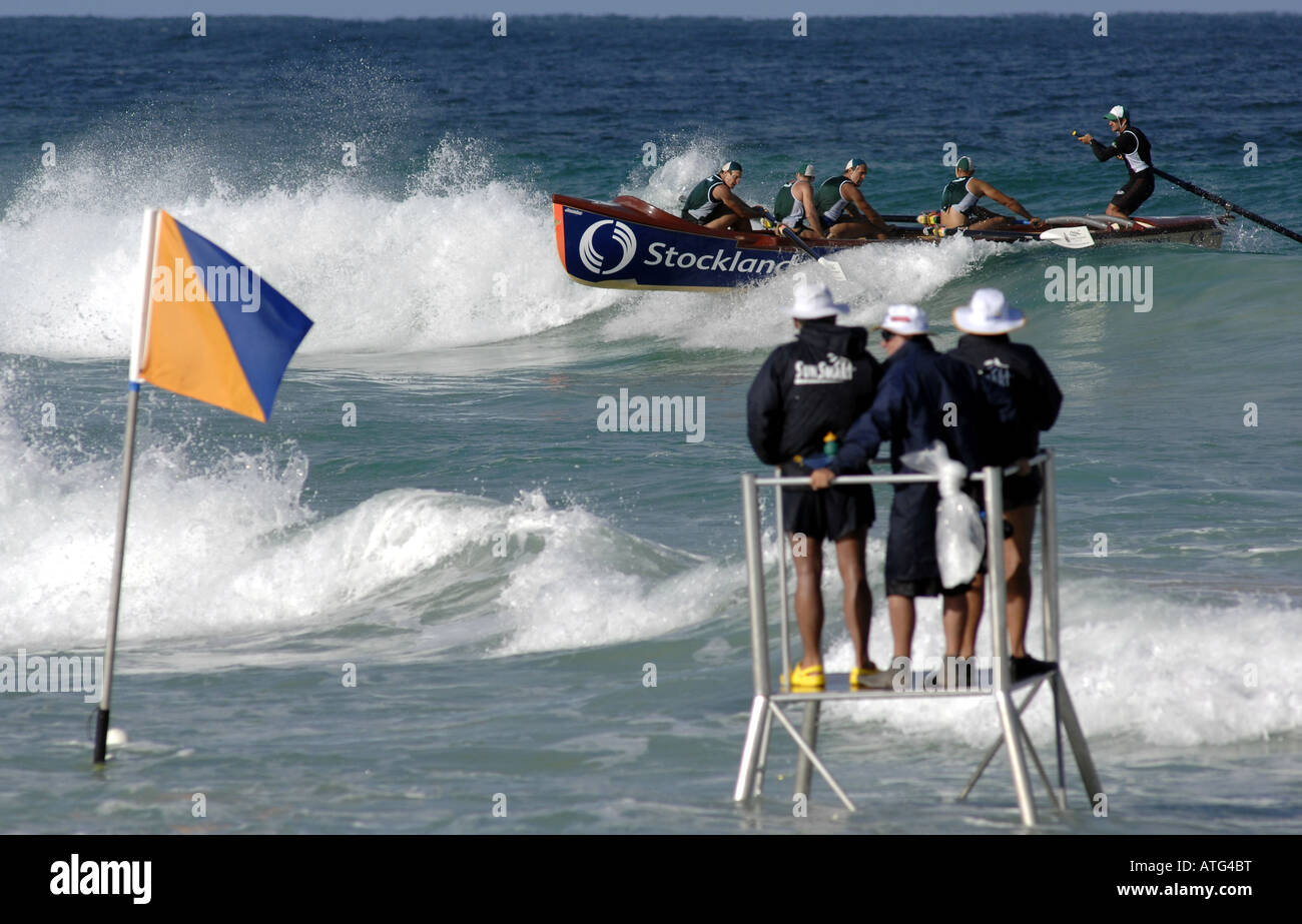 Judges watch a surf boat race in the National Surf Lifesaving ...