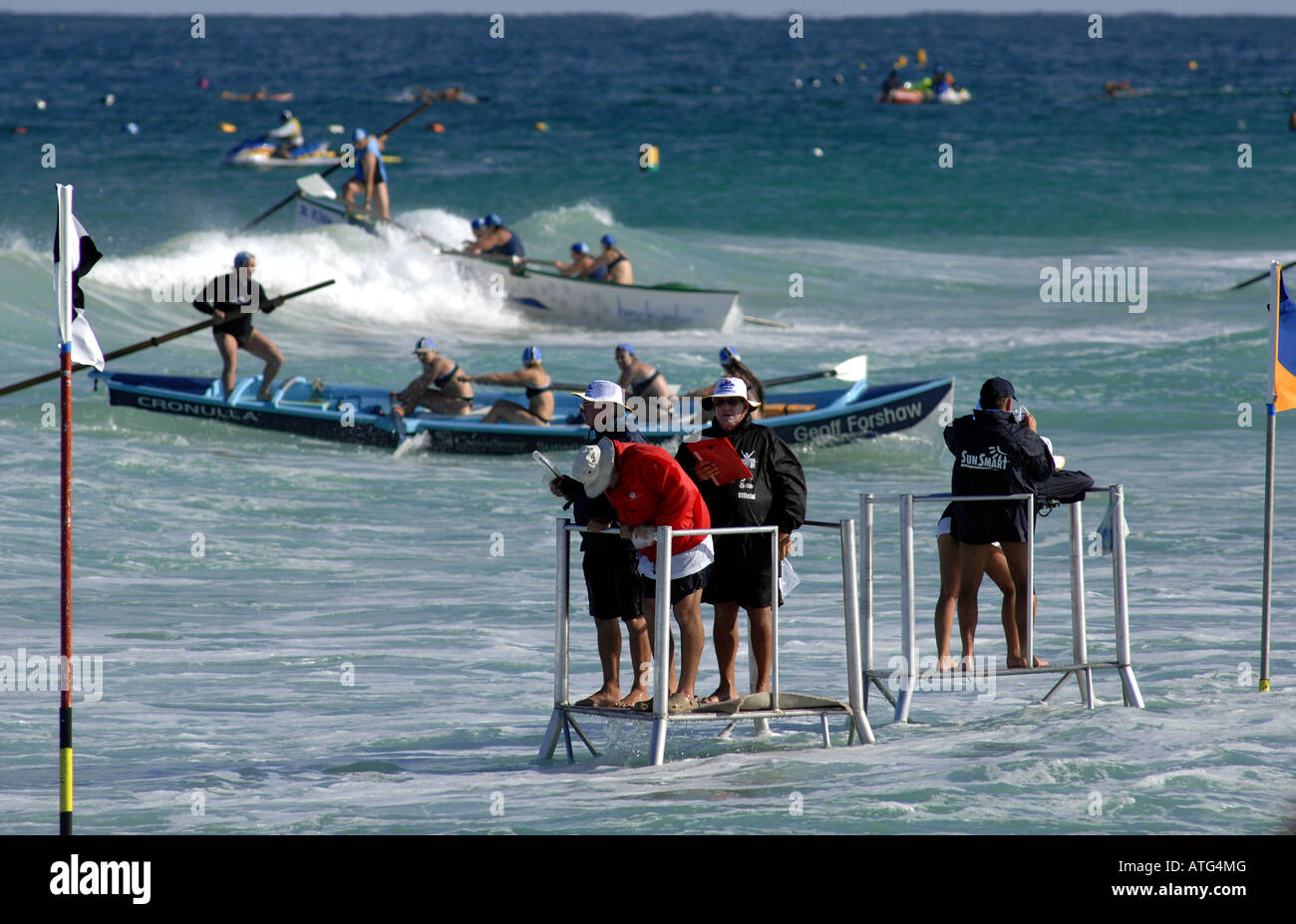 Judges watch the women's surf boat event in the National Surf ...
