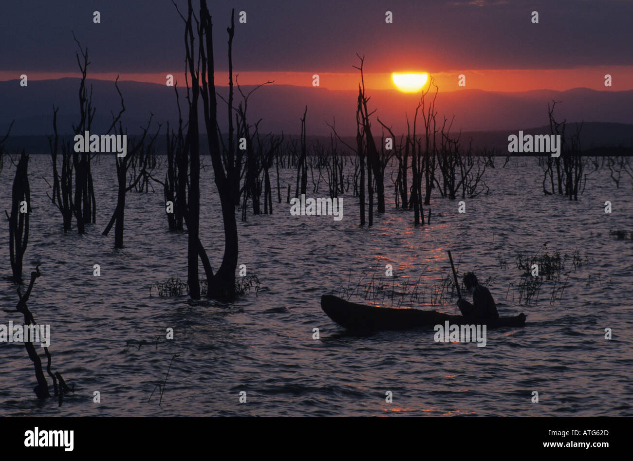Man in dugout Sunset Lake Kariba Zimbabwe Stock Photo - Alamy