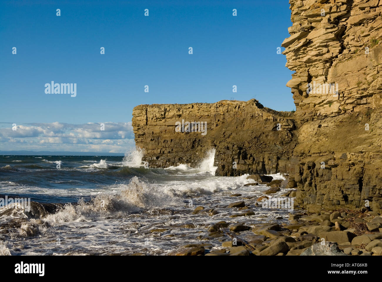 Stock image of cliffs and waves along the Acadian Peninsula on Canada s ...