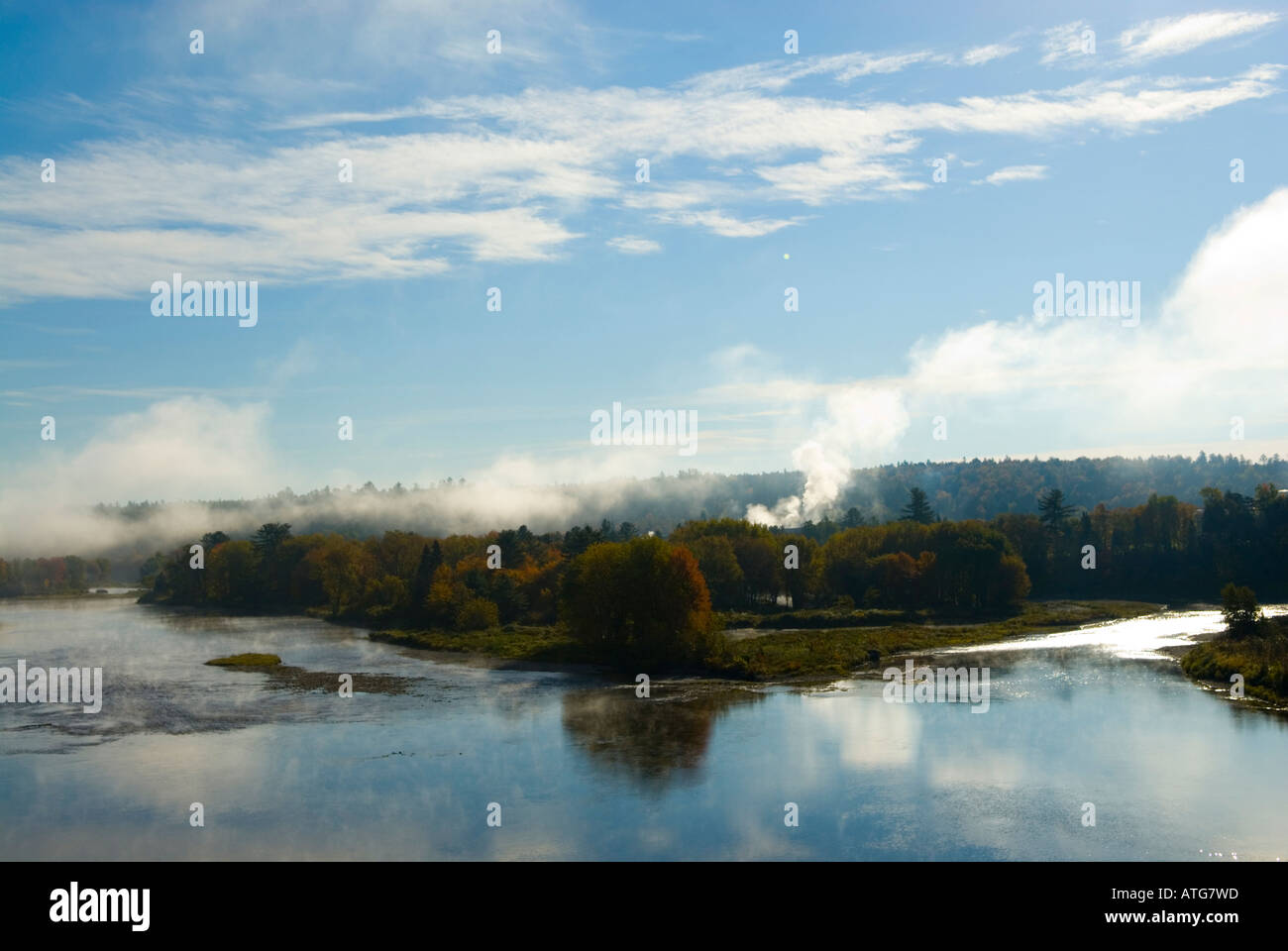 Stock image of early morning mist rising on the Miramichi River during ...