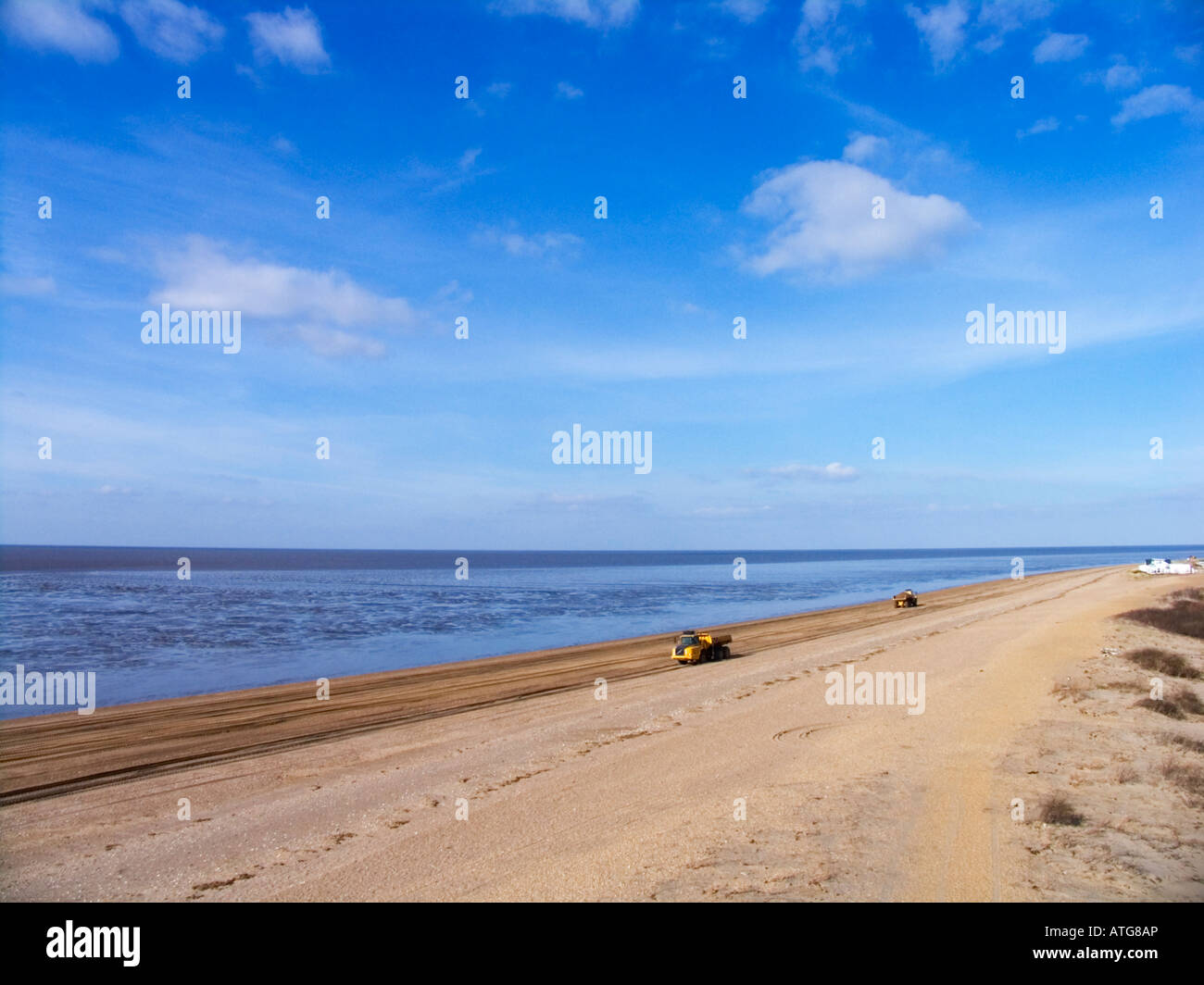 Truck moving sand on Snettisham beach Stock Photo - Alamy