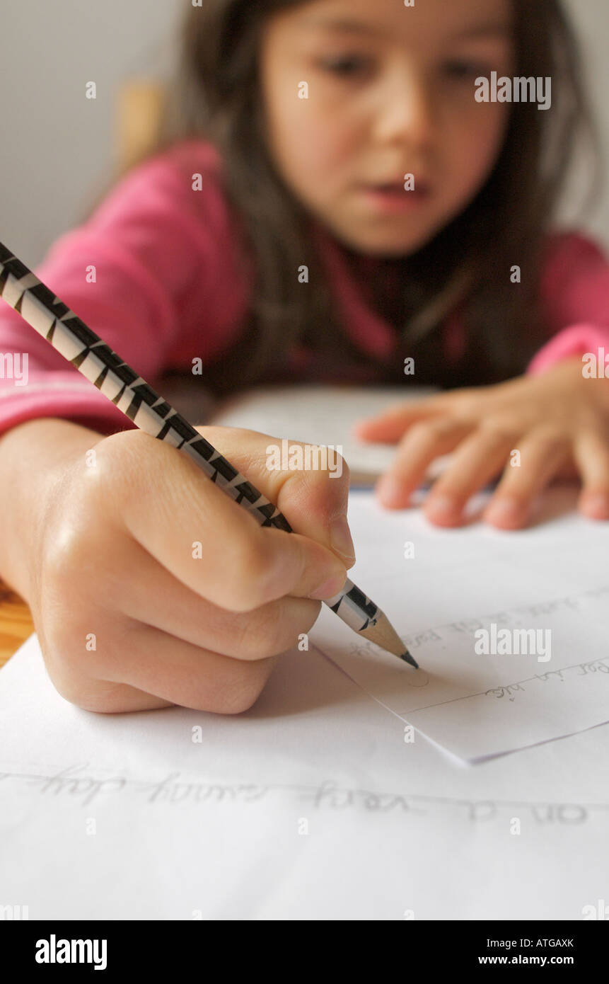 Child practicing writing Stock Photo - Alamy