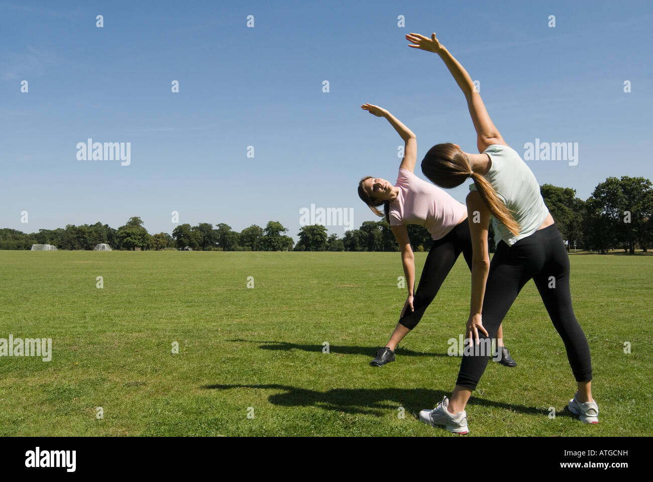 Women exercising in park Stock Photo - Alamy