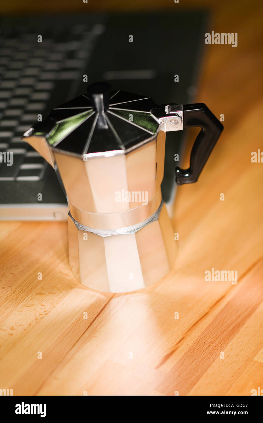 Espresso maker and laptop Stock Photo - Alamy