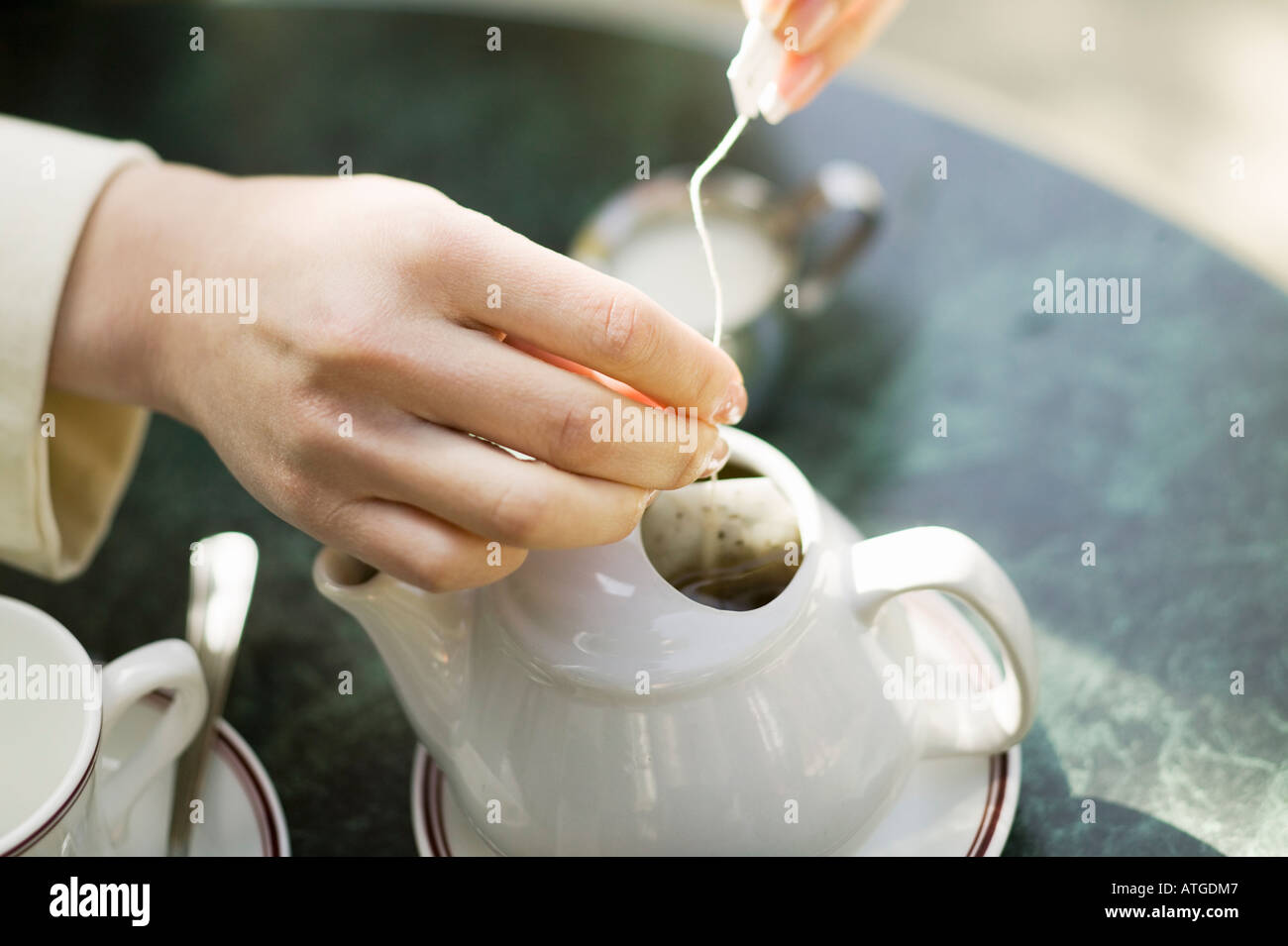 Old lady making tea hi-res stock photography and images - Alamy