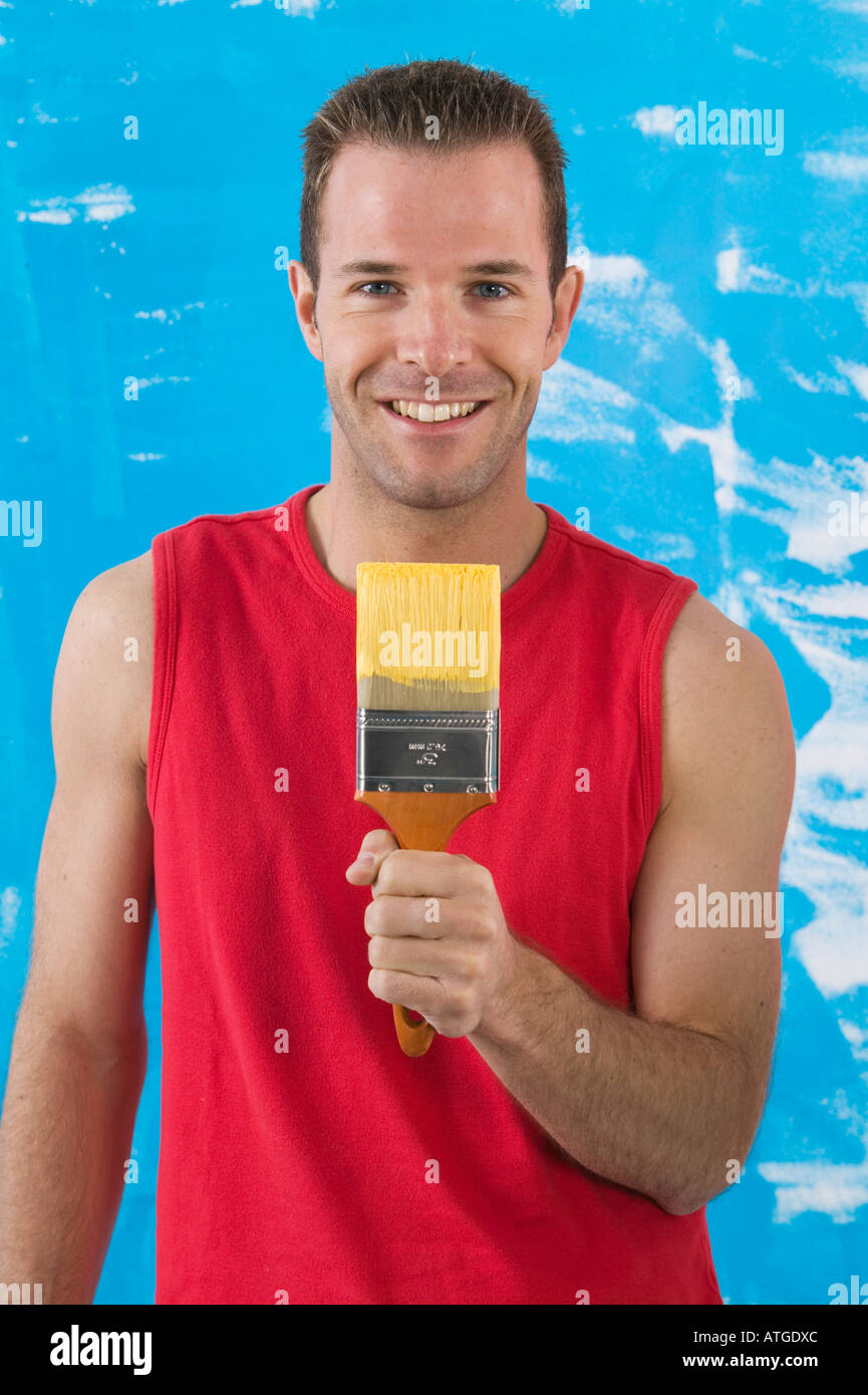 Happy man holding paint hi-res stock photography and images - Alamy