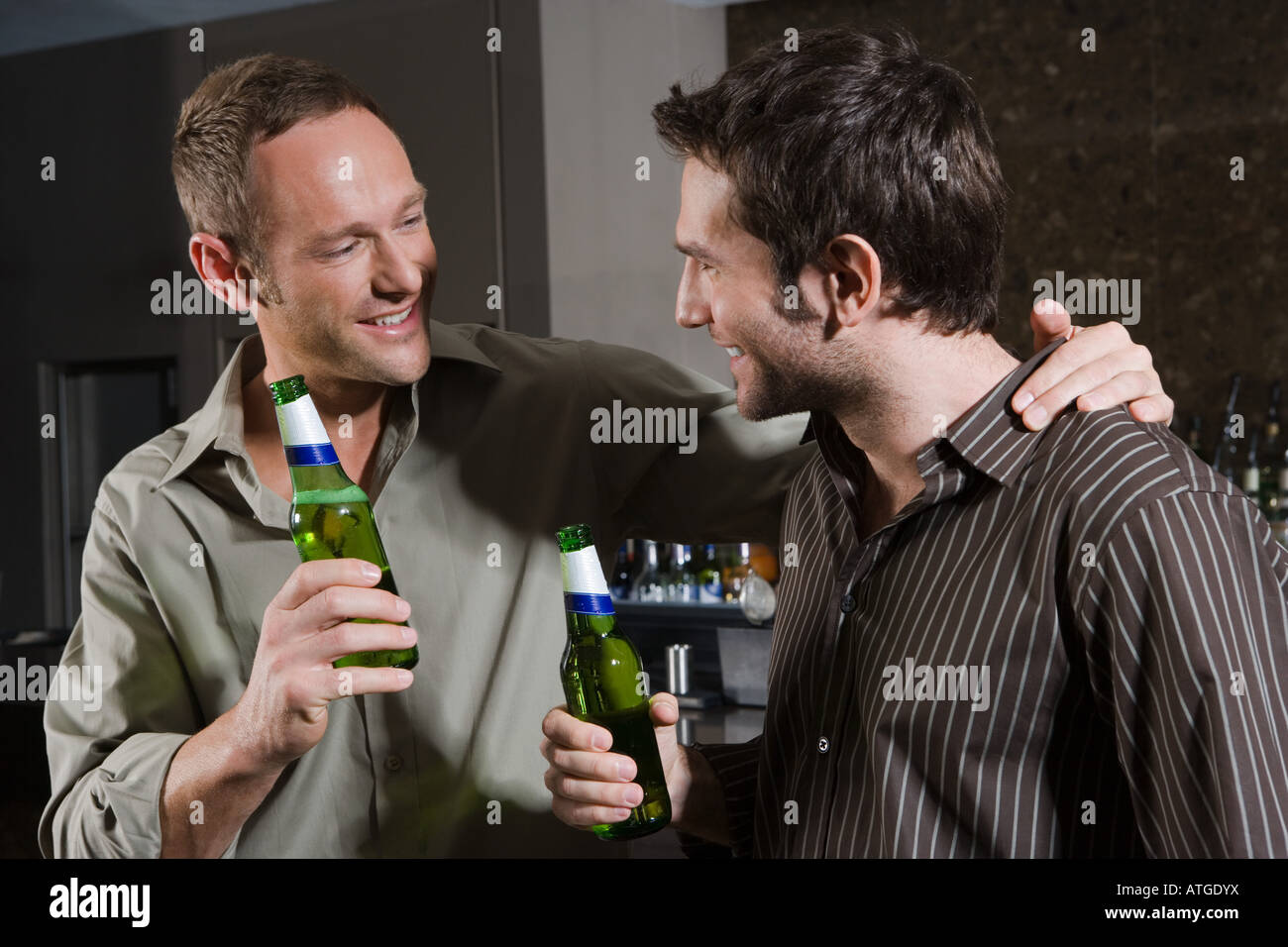 Two men drinking in a bar Stock Photo - Alamy