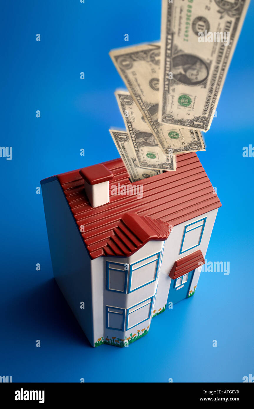 Money going into house Stock Photo - Alamy