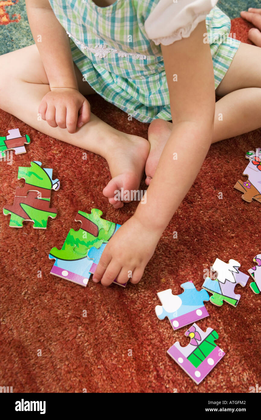 Young Girl Doing a Jigsaw Puzzle Stock Photo - Alamy