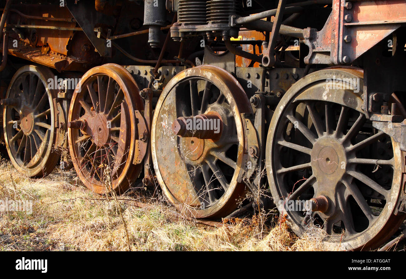 Abandoned old steam engine's wheels Stock Photo - Alamy
