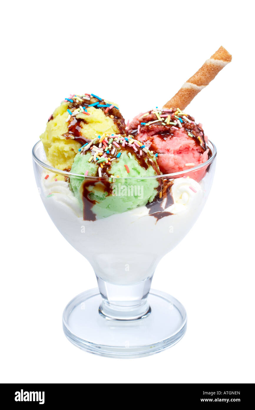 Delicious multi flavor ice cream with chocolate syrup in glass bowl ...