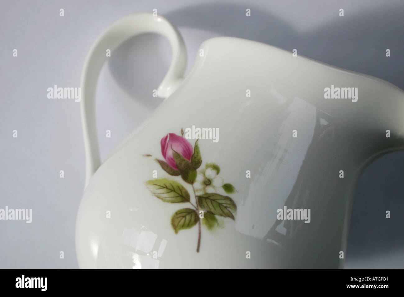 Antique Irish china milk jug with pink rose motif Stock Photo - Alamy