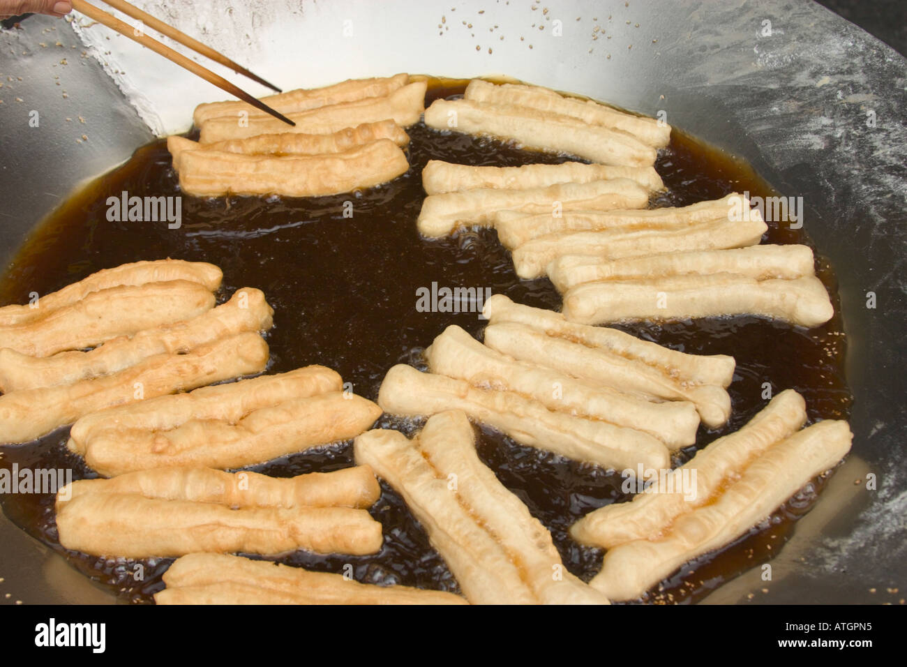 chinese croissant from malaysia being deep fried in wok Stock Photo - Alamy