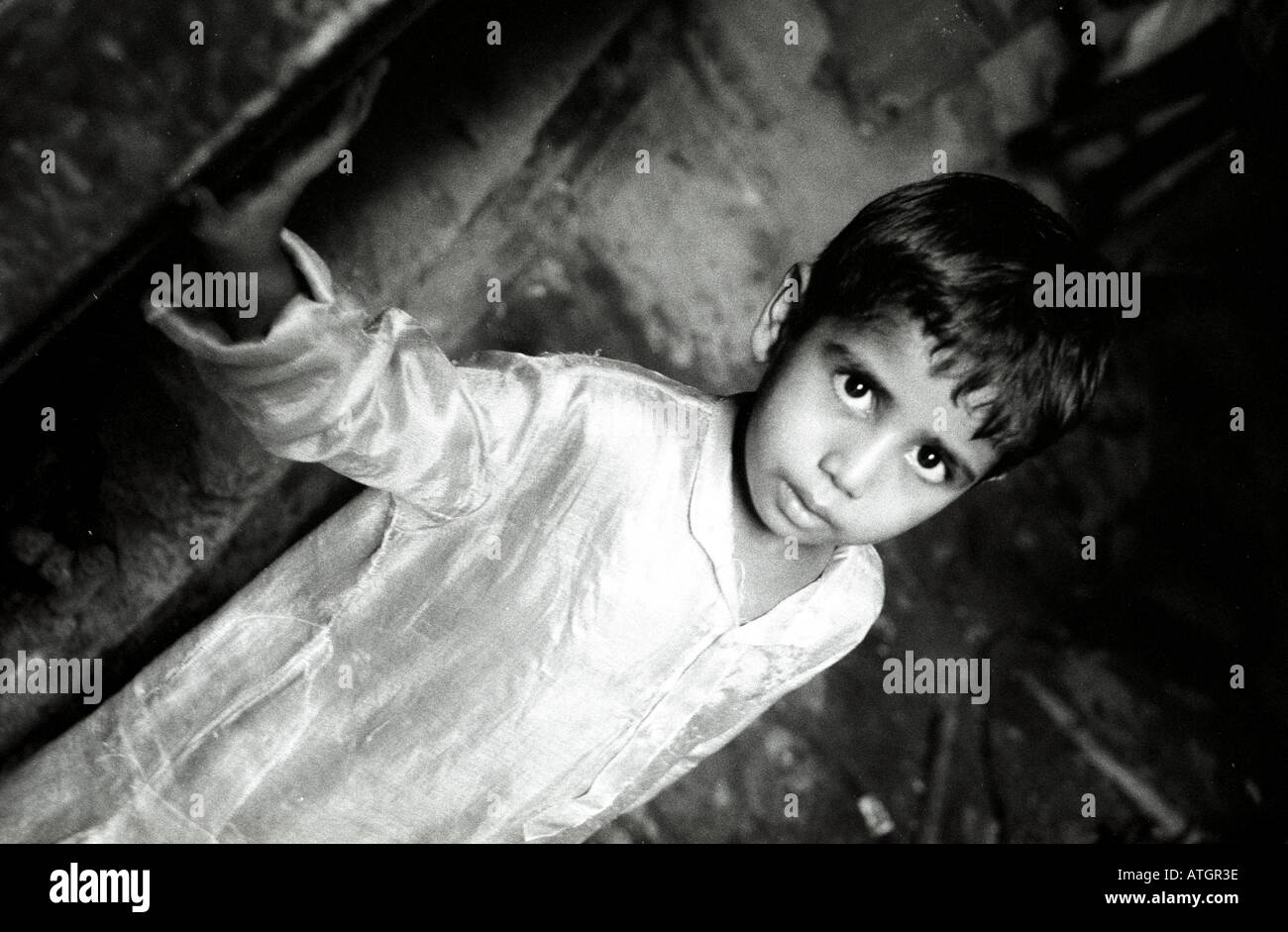 Portrait of a curios child downtown Old Delhi, India Stock Photo - Alamy